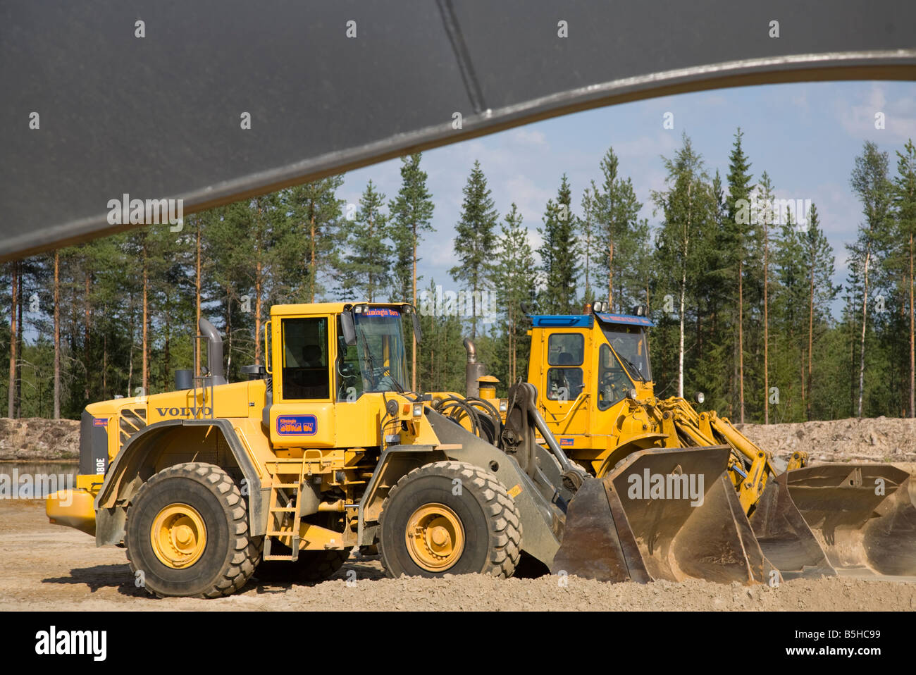 Yellow Volvo front loaders , earth movers , Finland Stock Photo - Alamy