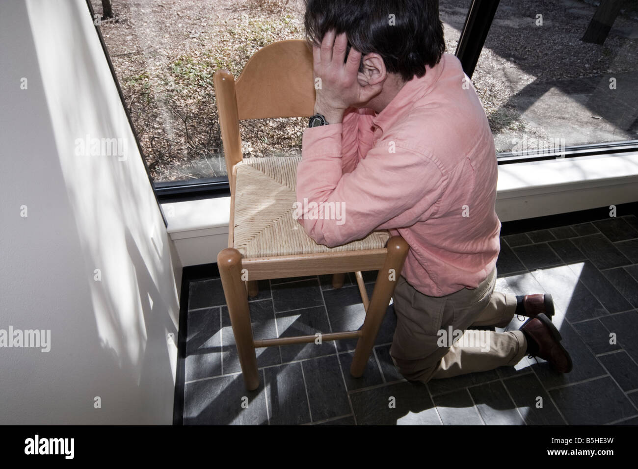 Leaning against a chair hi-res stock photography and images - Alamy