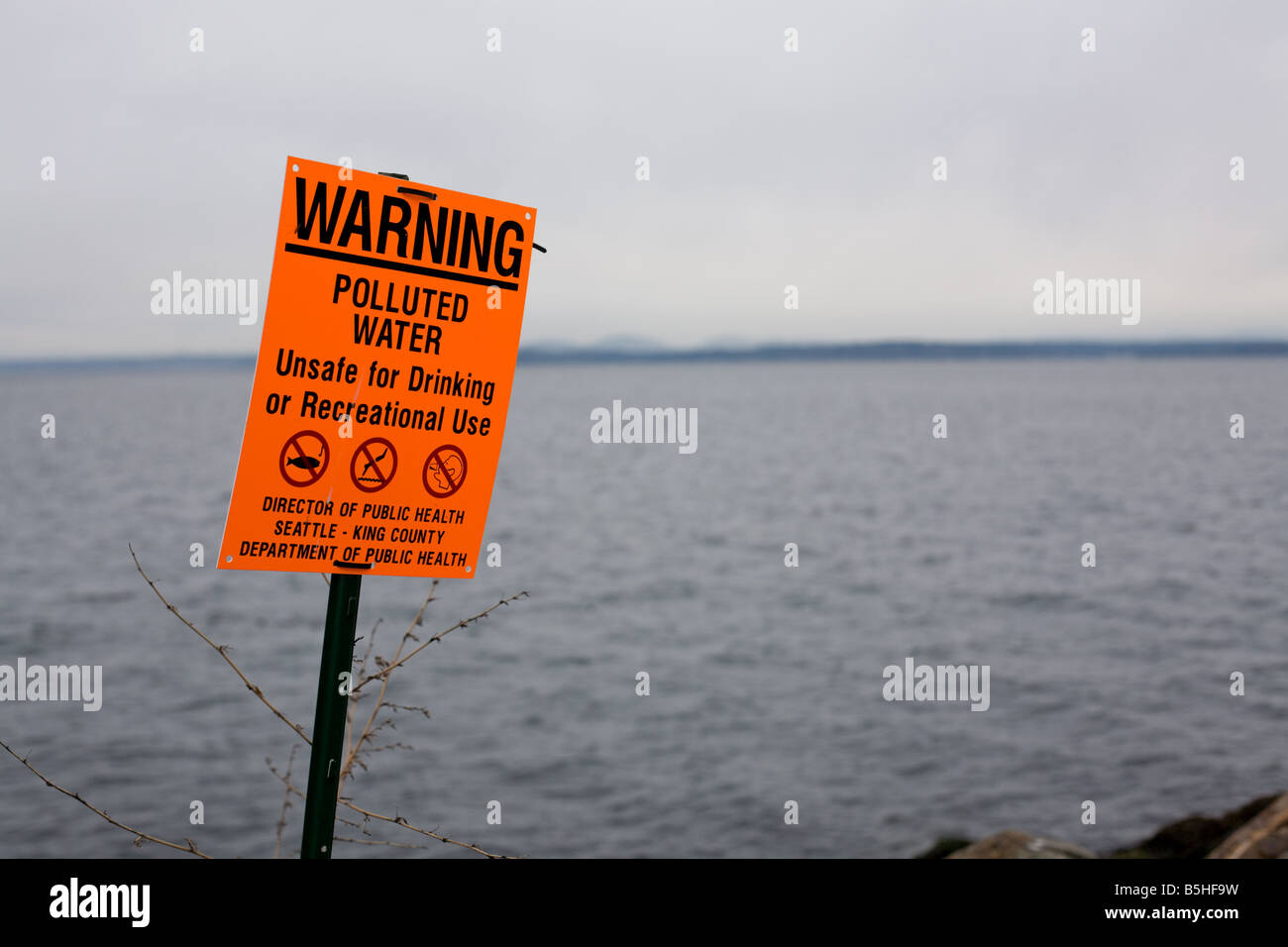 polluted water waning sign with puget sound in background Stock Photo ...