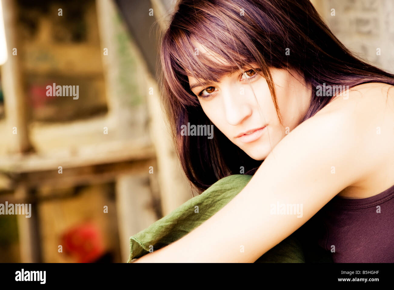 Young woman staring at camera Stock Photo - Alamy