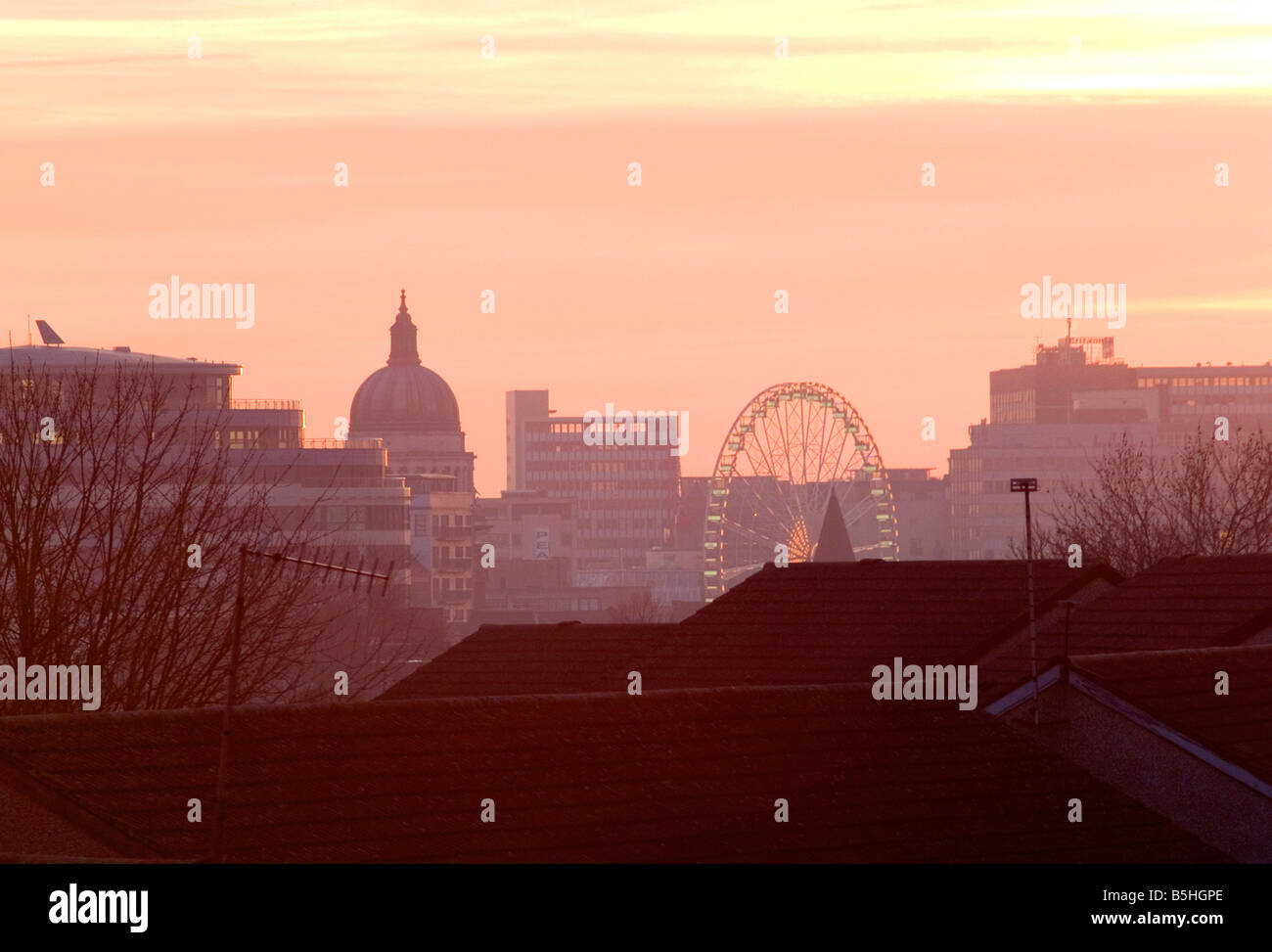 A salmon pink sunset over the skyline of Nottingham City Centre ...