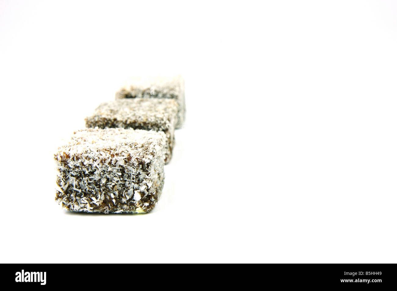 Lamingtons isolated against a white background Stock Photo - Alamy