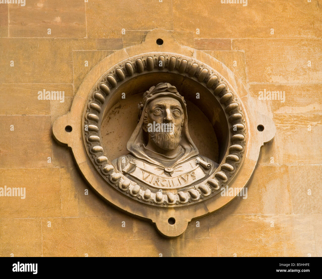 A stone statue carved into the exterior brick wall of Wollaton Hall in ...