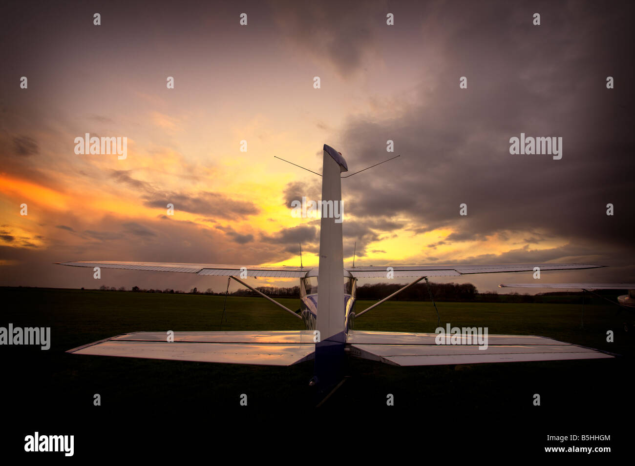 View of a sunset from behind the tail of a Cessna light aircraft Stock ...