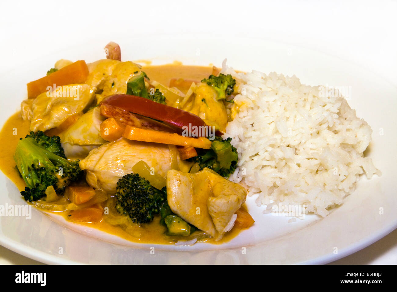 Red Curry Chicken and Rice Stock Photo - Alamy