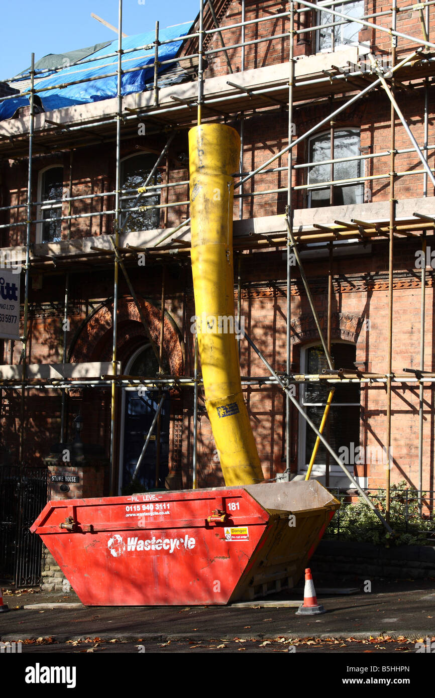Builders skip outside a house in the Park Estate, Nottingham, England ...