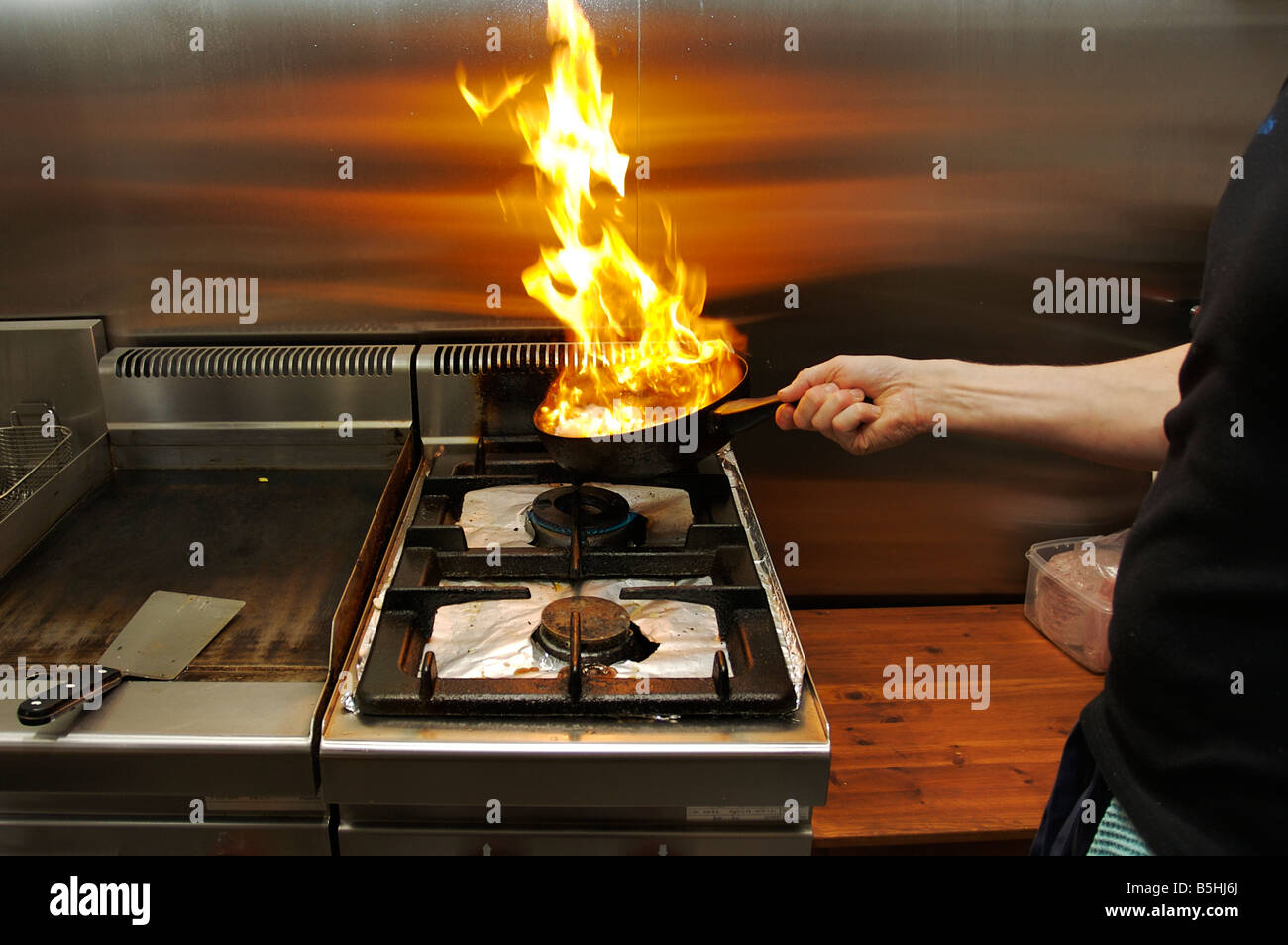 Cooking with fire Stock Photo - Alamy