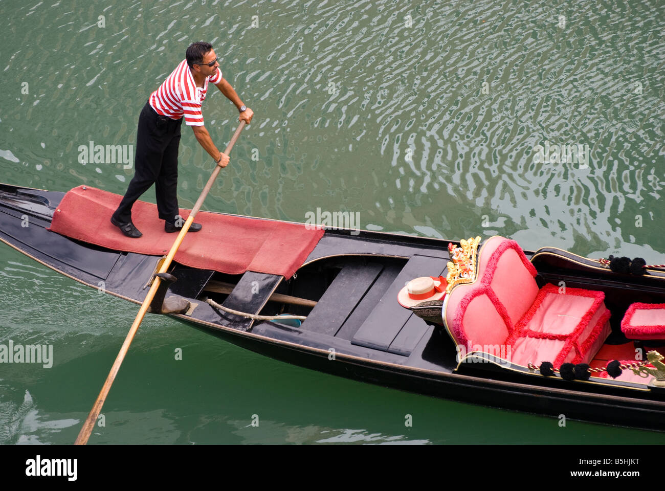 Venice gondolier rowing his gondola on Grand Canal Venice Italy Stock ...