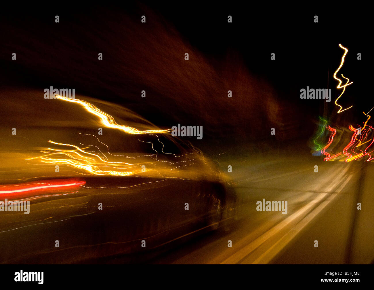 A car being driven at speed at night Stock Photo - Alamy