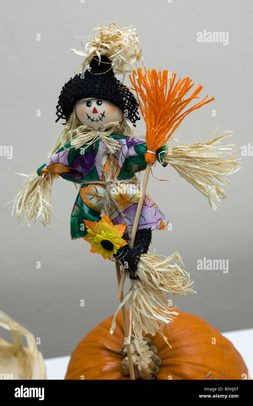 Charming Halloween straw witch doll with broomstick and pumpkin Stock ...