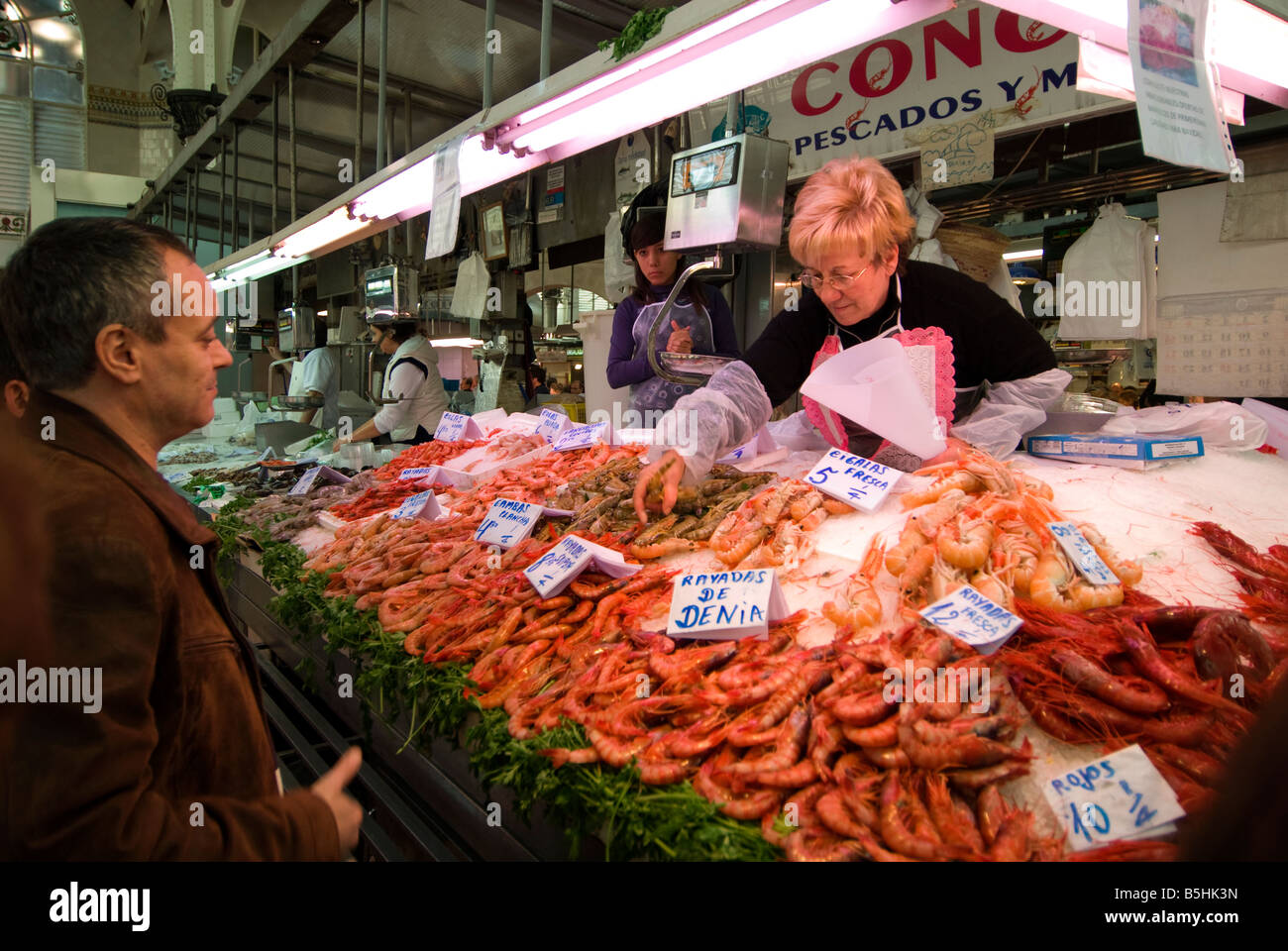 Spanish person buying fish in the central fish market Mercado Central ...