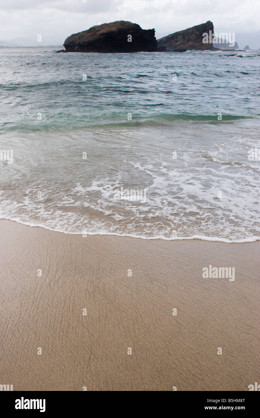 waves on a sandy beach in south java Stock Photo - Alamy