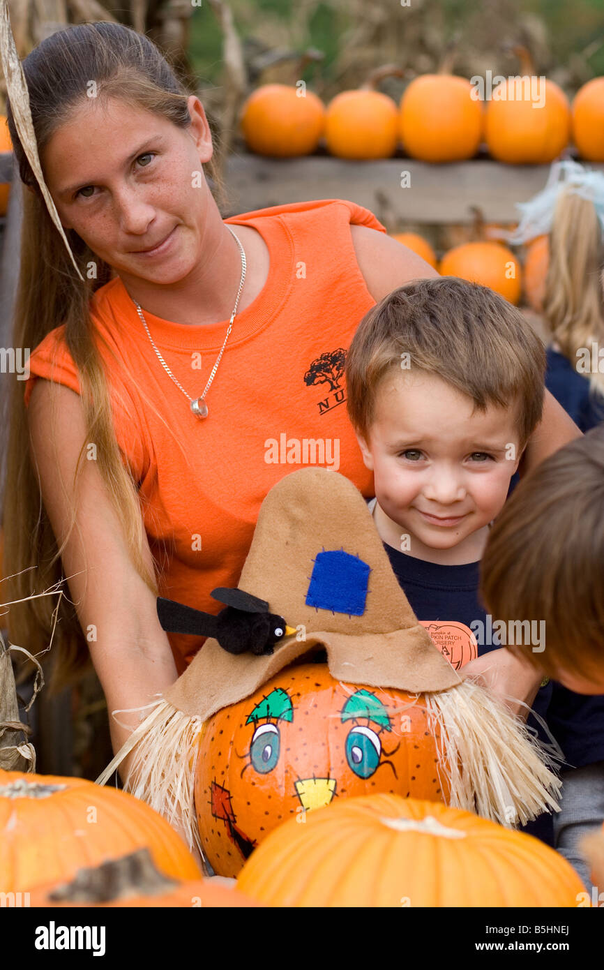 Kids playing pumpkin patch hi-res stock photography and images - Alamy