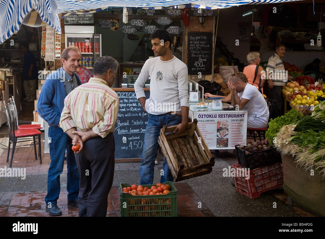 Turkish people traders and shoppers at a fruit and vegetable market ...