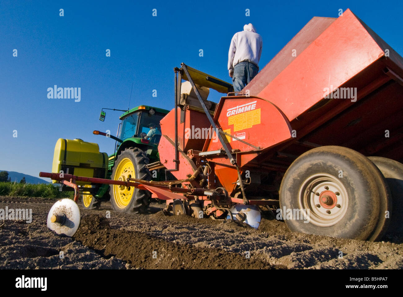 Tractor and potato planting machine hi-res stock photography and images ...
