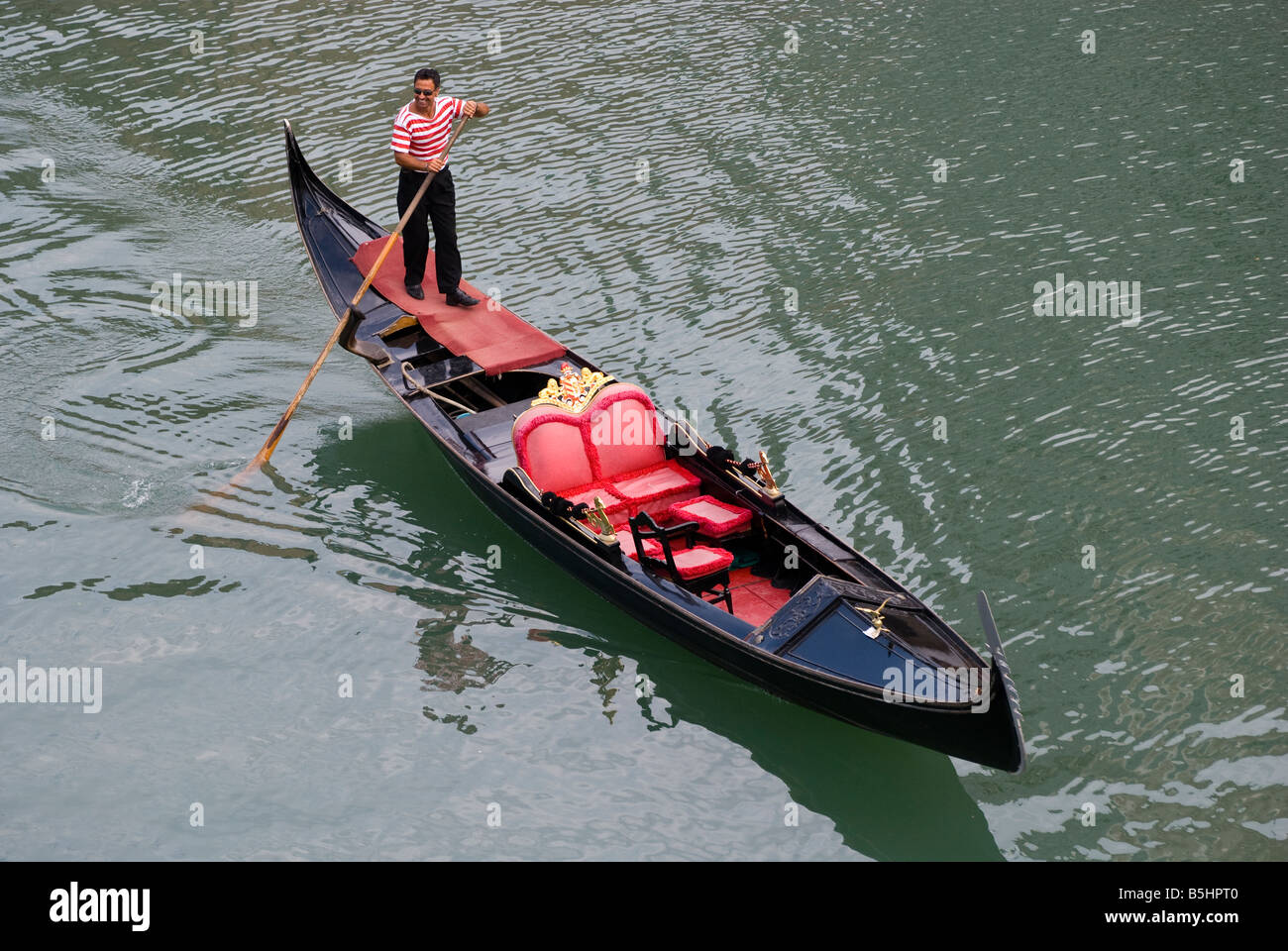 Venice gondolier rowing his gondola on Grand Canal Venice Italy Stock ...