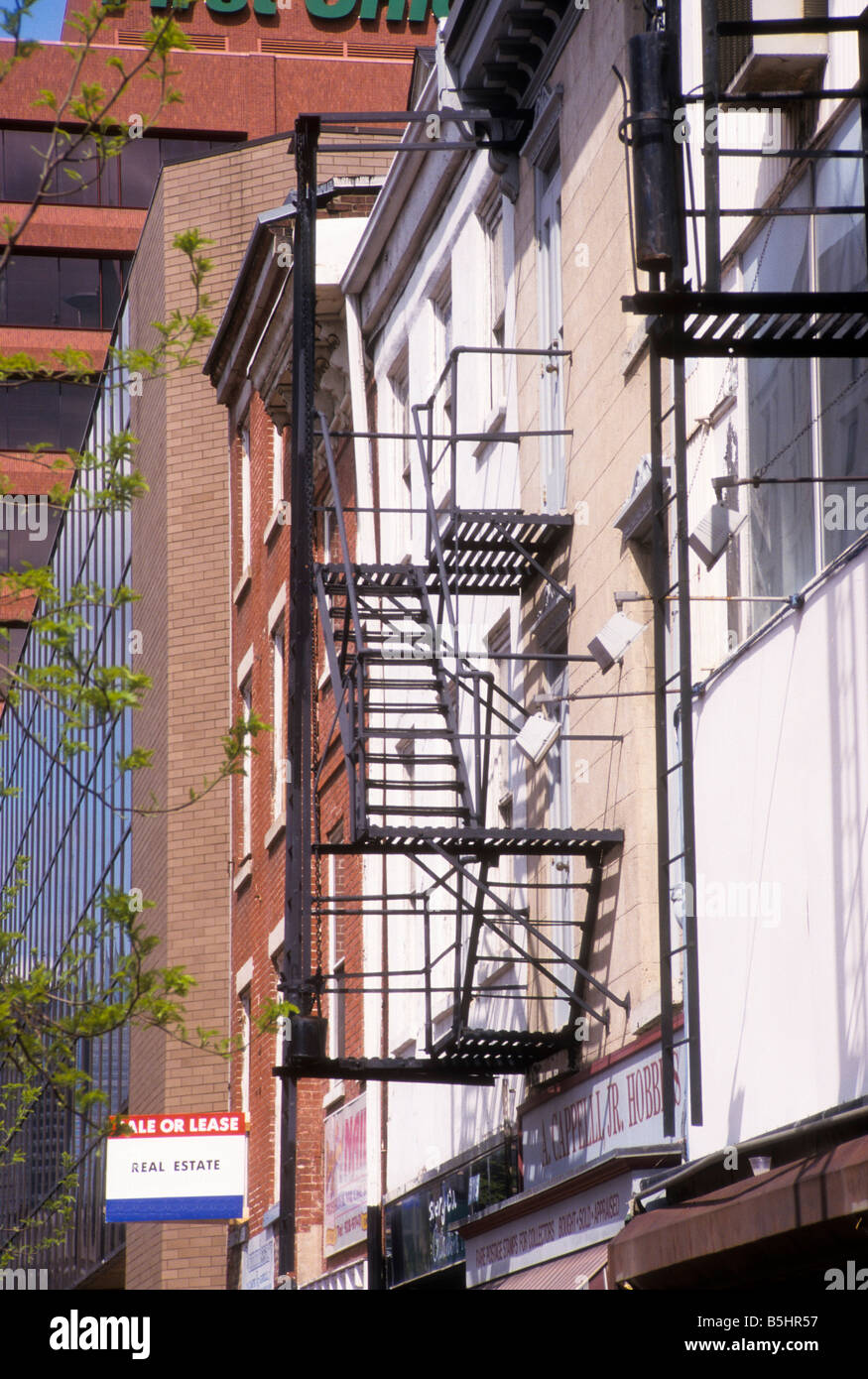 metal fire escape stairs on outside of old building Stock Photo - Alamy
