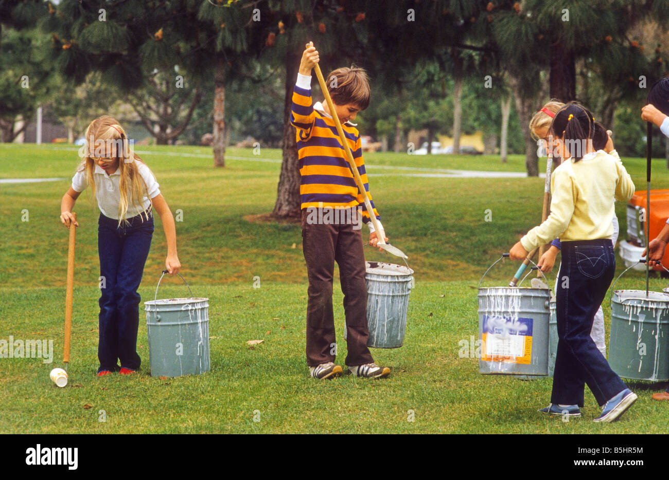 Children pick up litter in public park Stock Photo - Alamy