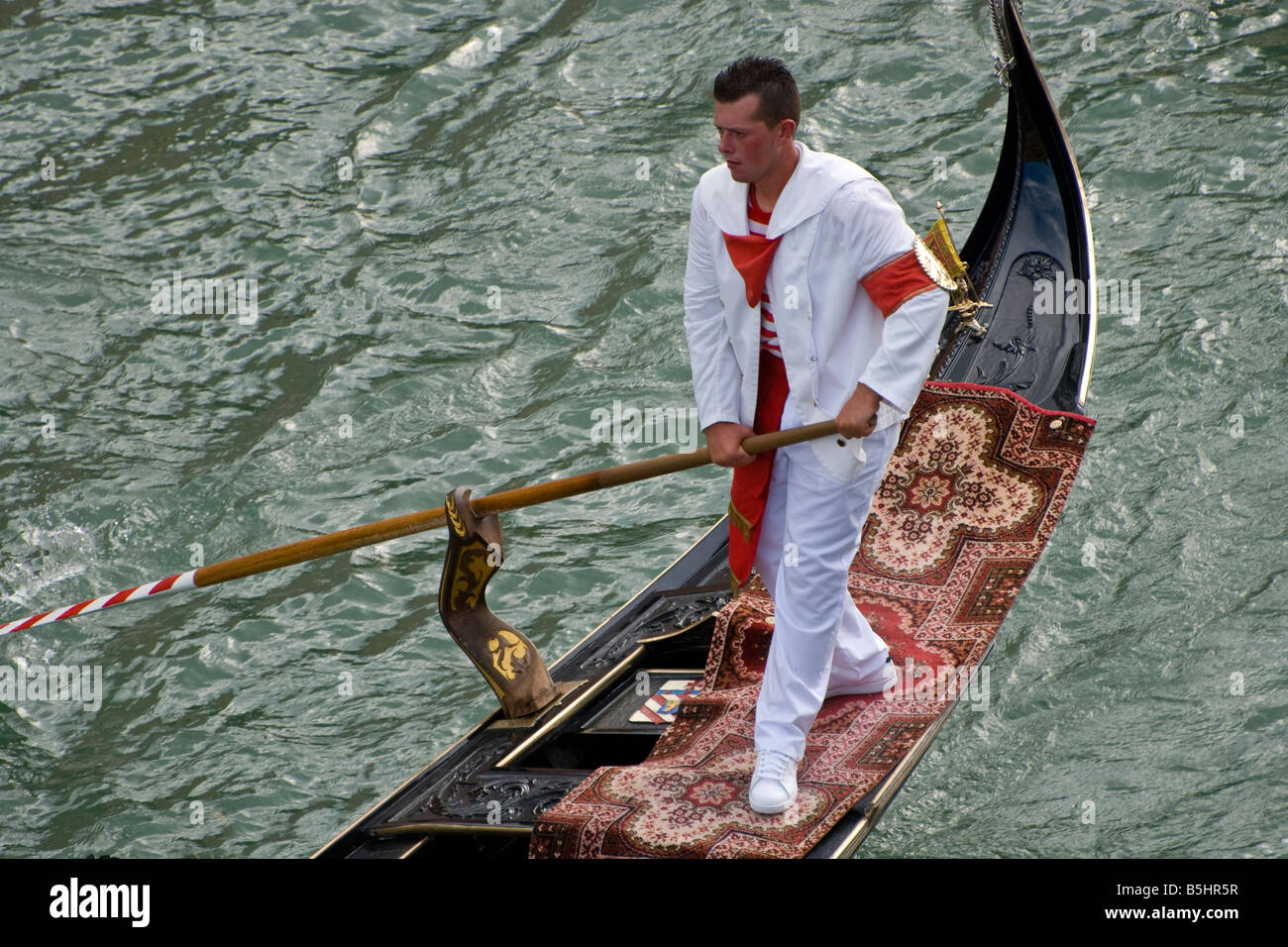 Venice gondolier rowing his gondola on Grand Canal Venice Italy Stock ...