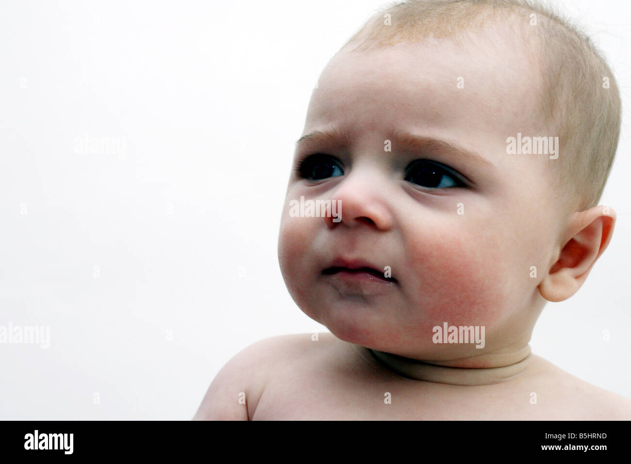 CUTE BABY BOY SMILING CURIOUSLY AT CAMERA Stock Photo - Alamy