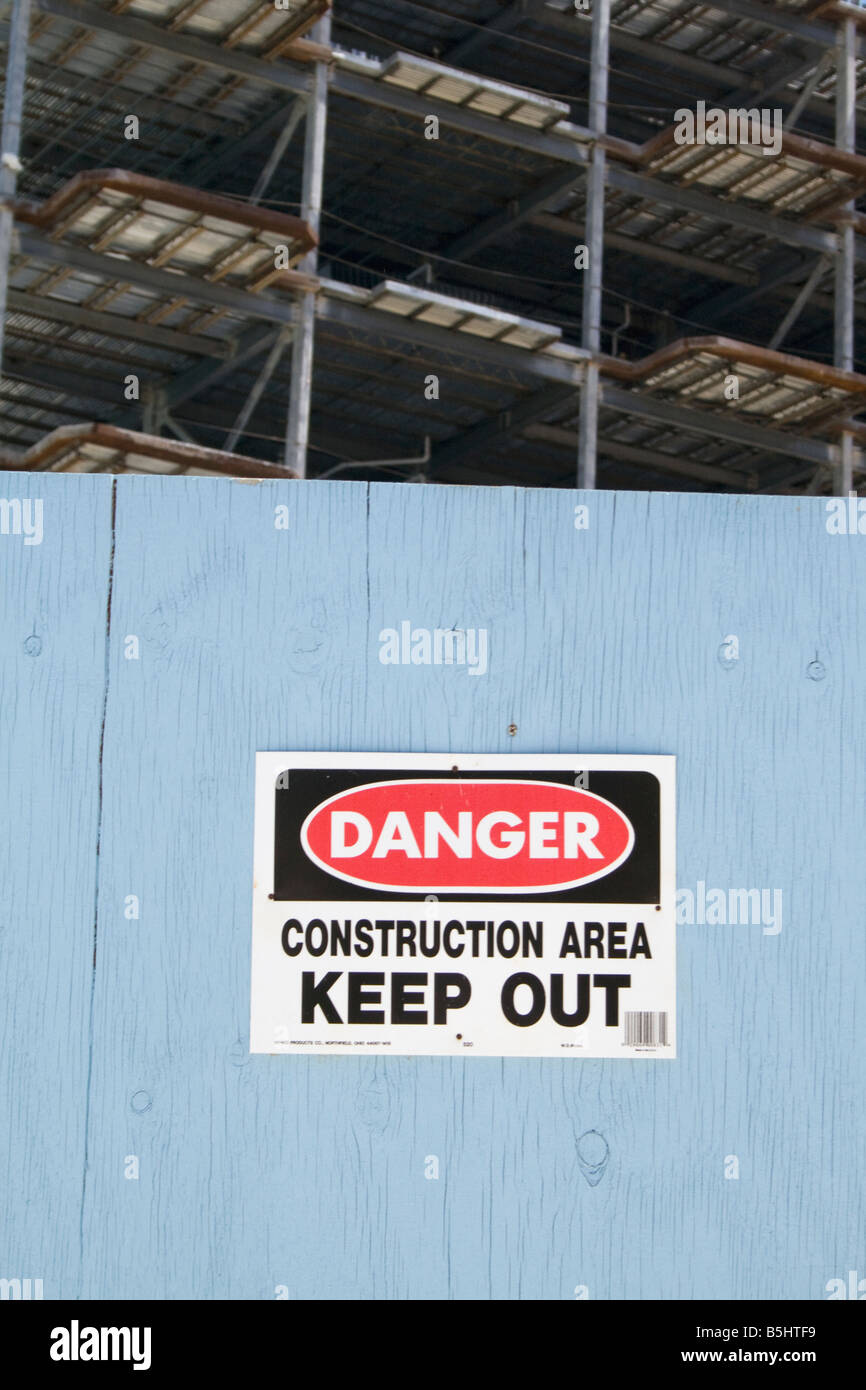 DANGER Construction Area Keep Out sign posted on plywood barrier in ...