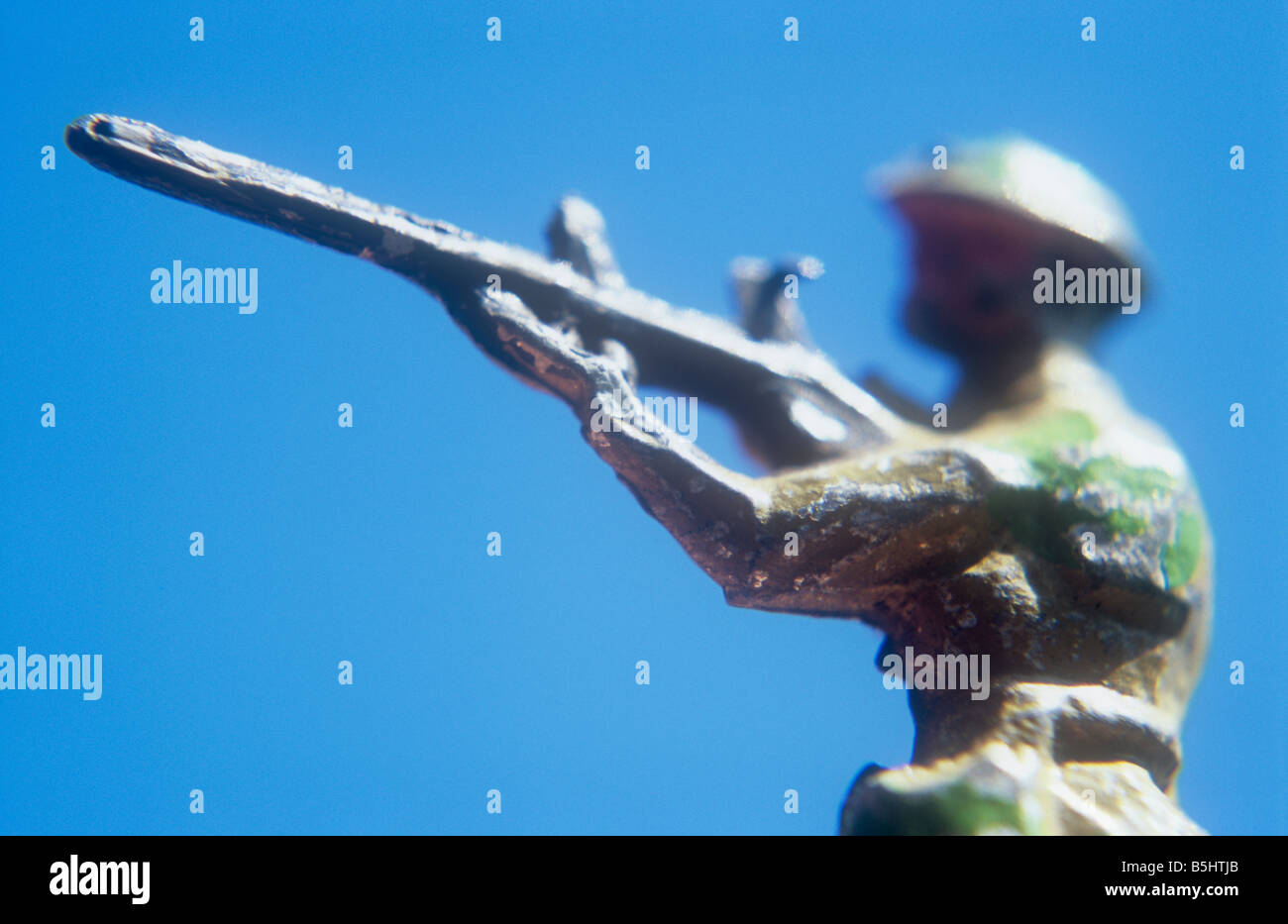Close up of battered painted lead miniature model of soldier in khaki ...