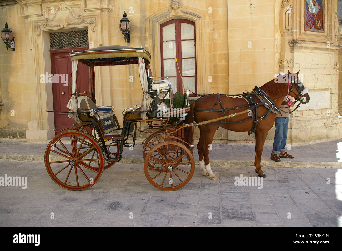 A traditional horse drawn karrozzin carriage at Mdina Malta Stock Photo ...