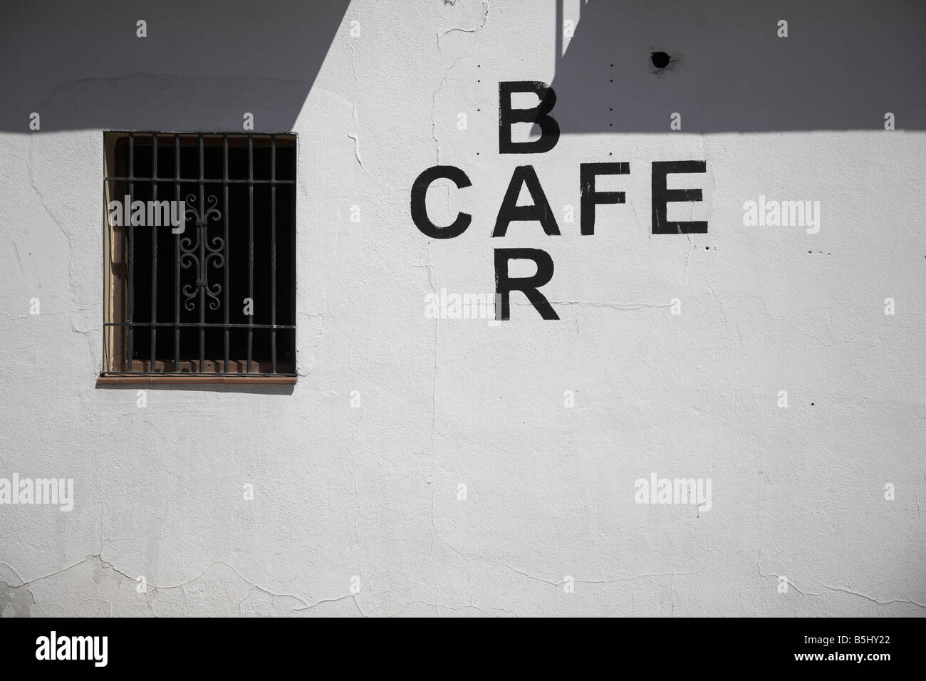 Bar cafe sign on the external wall of white building Stock Photo - Alamy