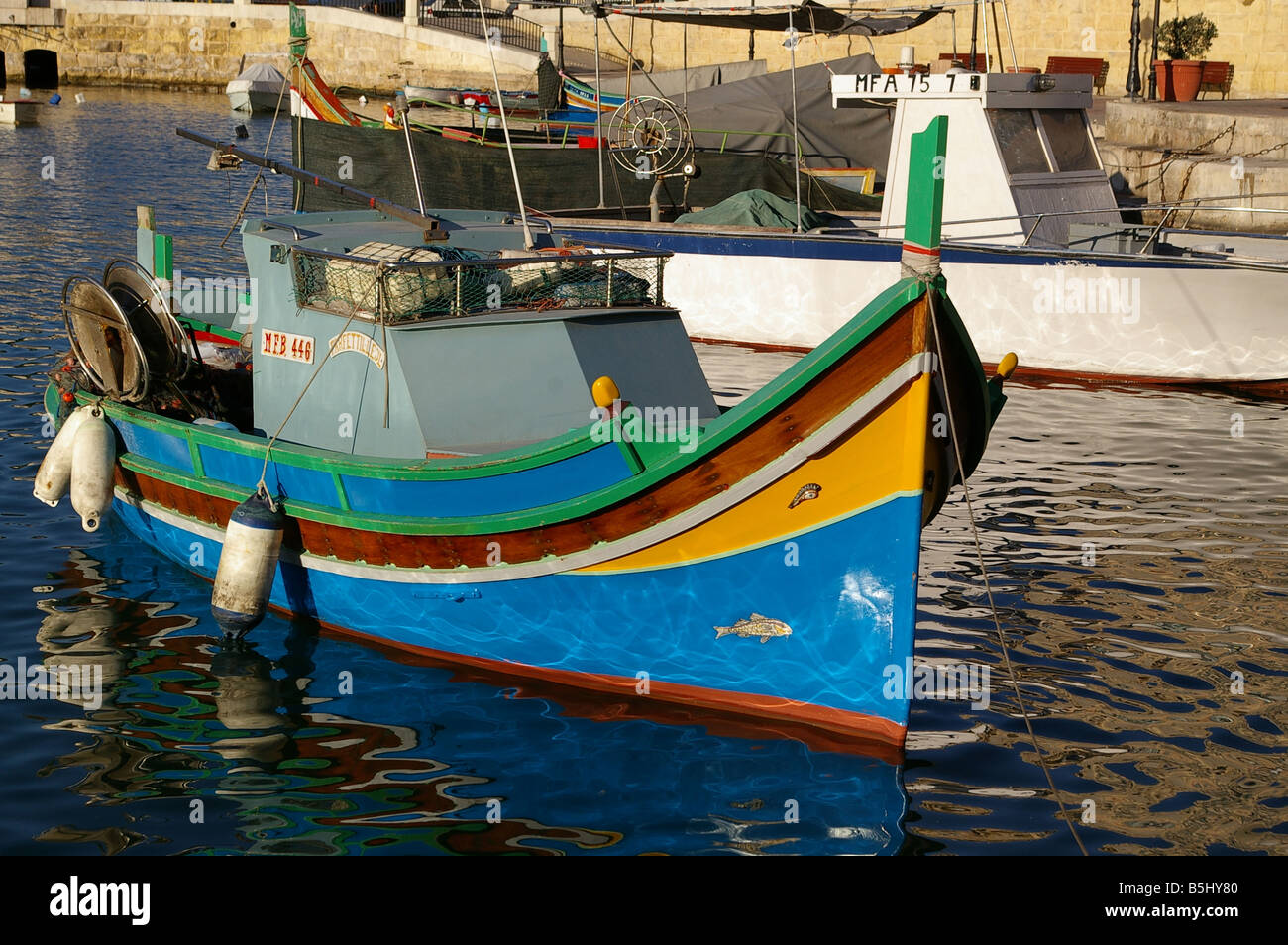 Traditional style Maltese fishing boat at Spinola Bay Malta Stock Photo ...