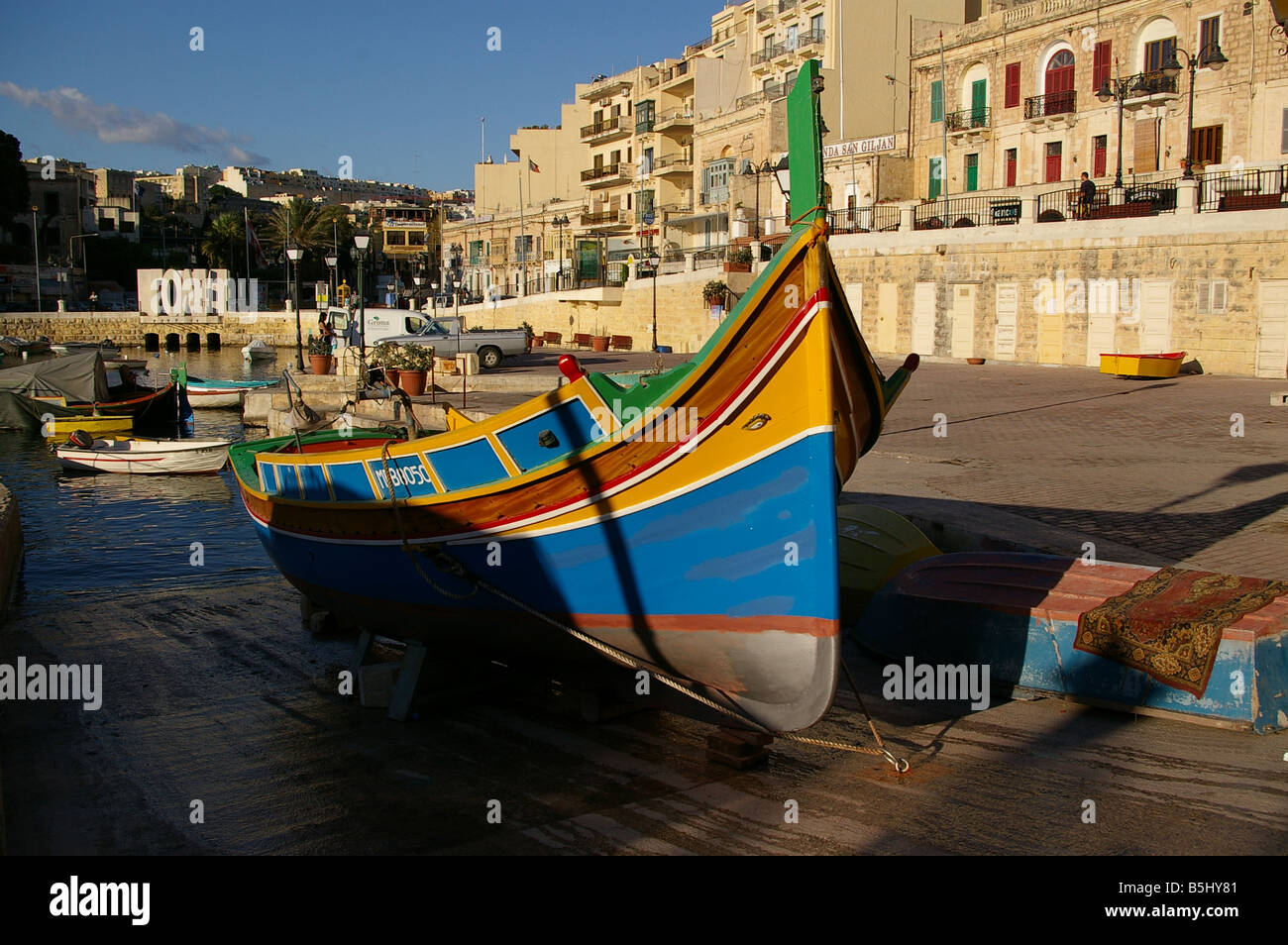 A traditional Maltese fishing boat on a slipway at Spinola Bay Malta ...