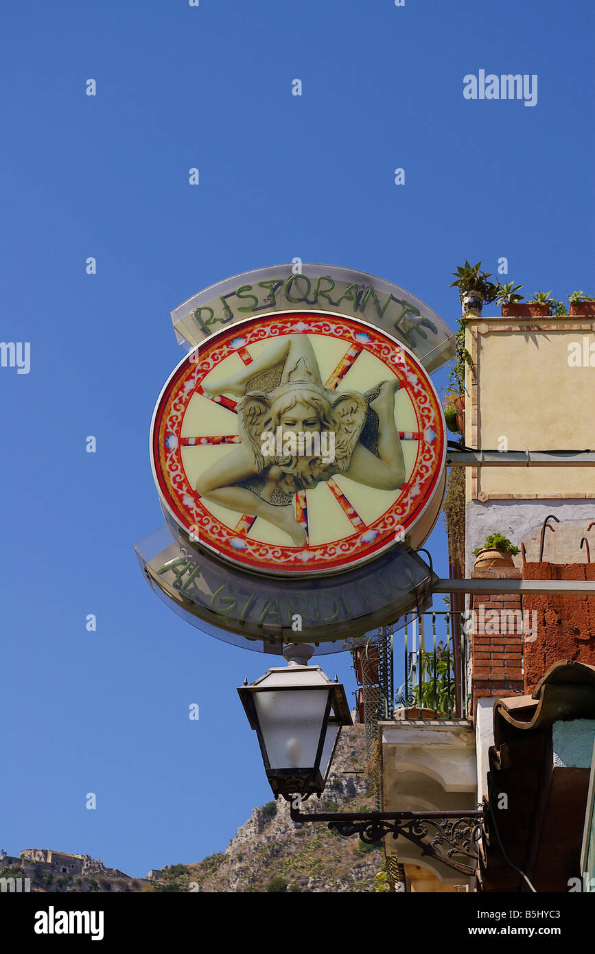 An unusual sign outside a restaurant at Taormina, Sicily Stock Photo ...