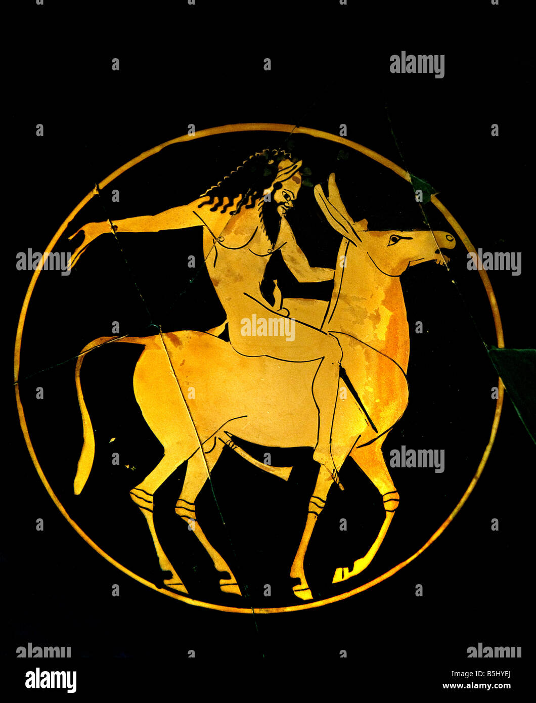 Kylix painted by Epiktetos illustrating a satyr on a donkey, ca 510 BC ...