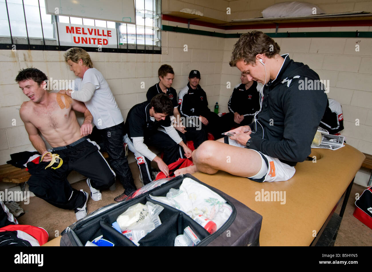 Soccer team getting change in changing room before game Stock Photo - Alamy