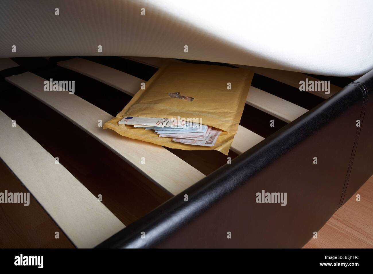 wad of 50 20 and 10 euro notes cash in an envelope stuffed under the ...