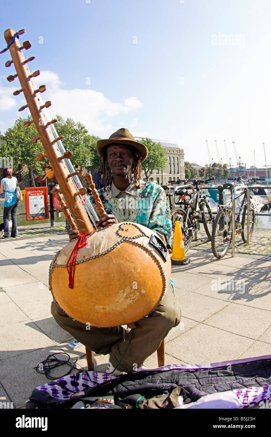 Musician playing a 12 string Kora instrument at Bristol Community ...
