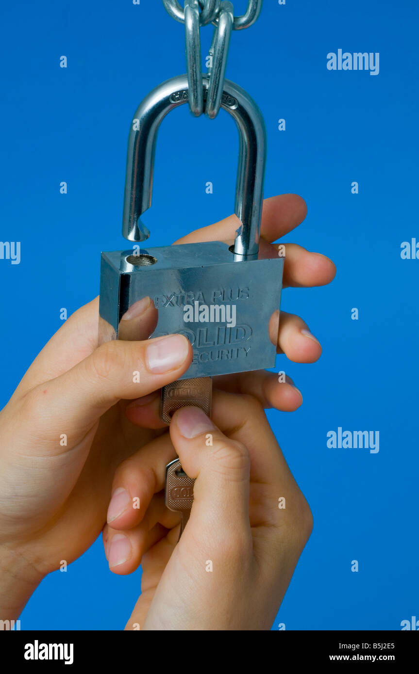 Opening a strong padlock Stock Photo - Alamy