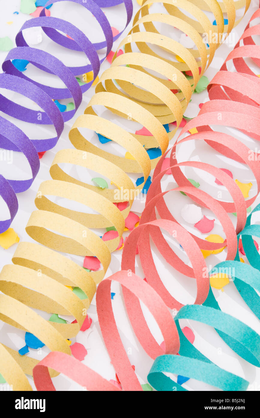 Several colourful party paper ribbons and confetti Stock Photo - Alamy