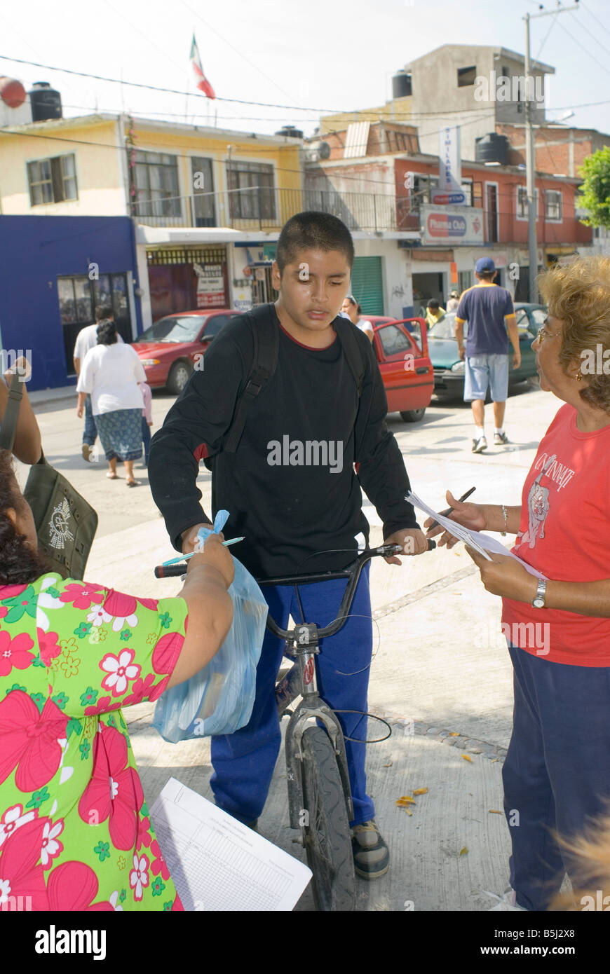 Striking teachers hand out books and study guides to their students ...