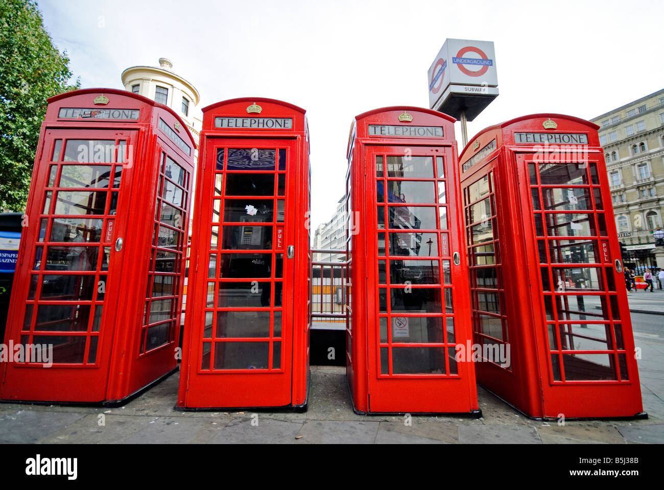 LONDON, UK - A row of four red telephone phone boxes in London, United ...