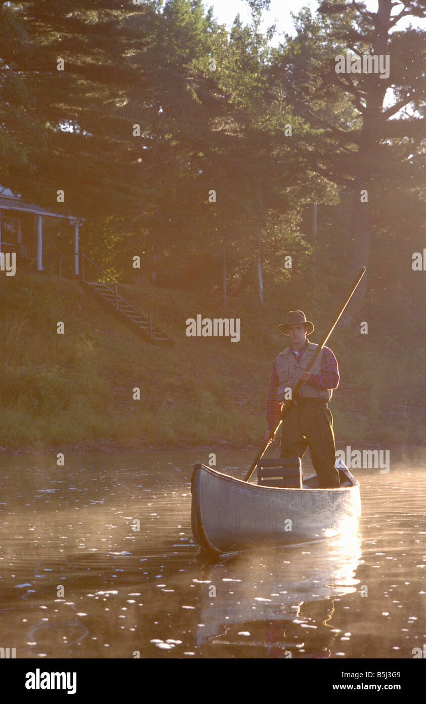 Poling a canoe on the famous salmon river the Miramichi in New ...