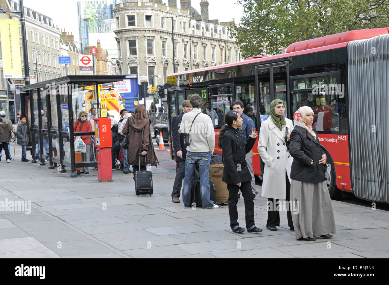 Queue people waiting bus stop hi-res stock photography and images - Alamy