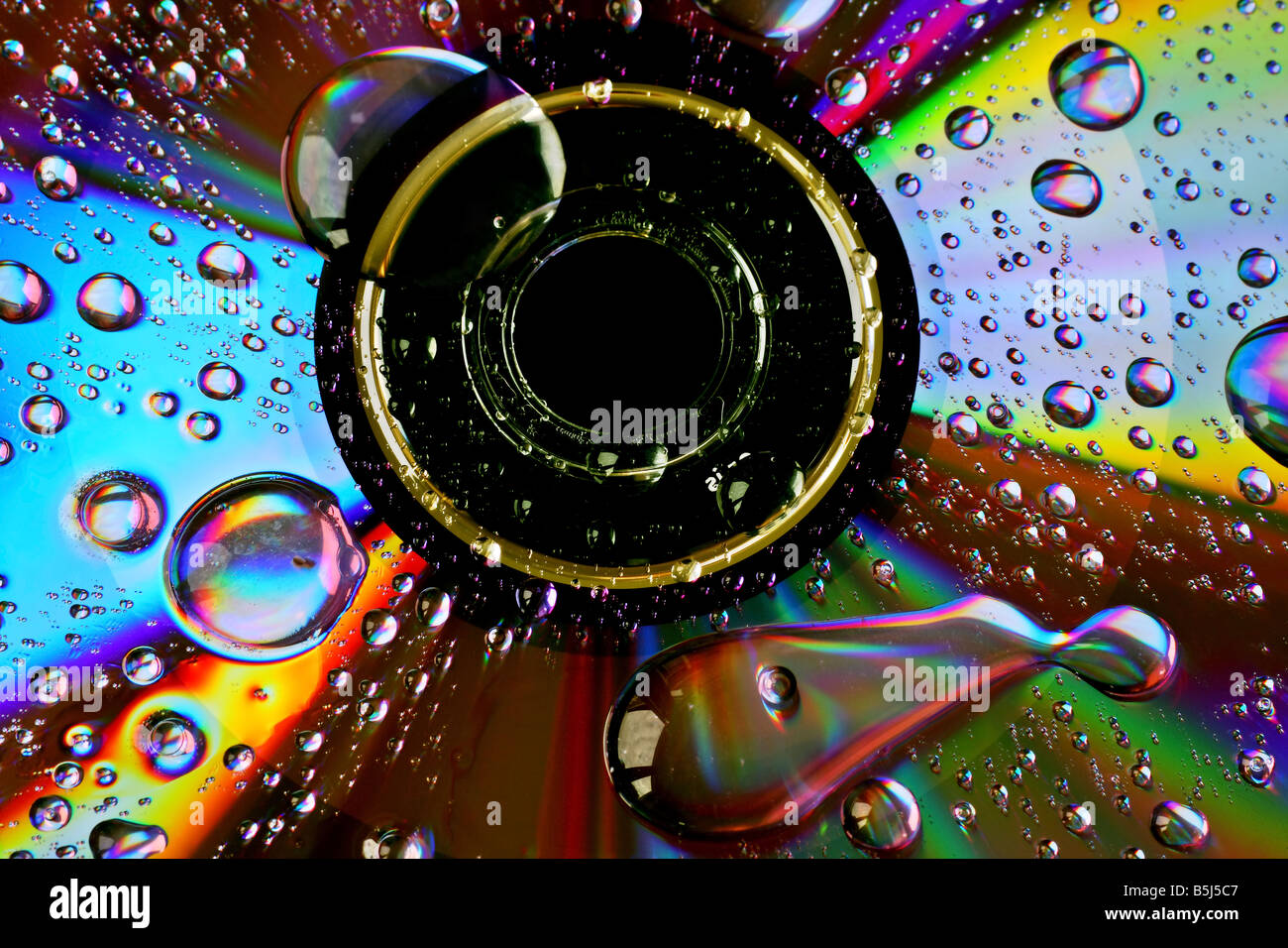 media disk with psychedelic colours and water droplets Stock Photo - Alamy