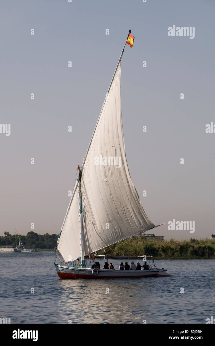 Traditional wooden Felucca sailing boat on the Nile river in Aswan ...
