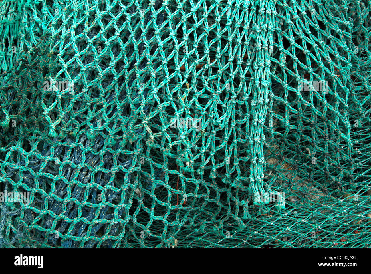 fishing nets harbour quay wall side multicolour Stock Photo - Alamy