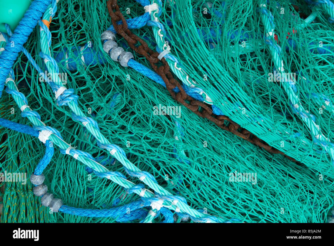 fishing nets harbour quay wall side multicolour Stock Photo - Alamy