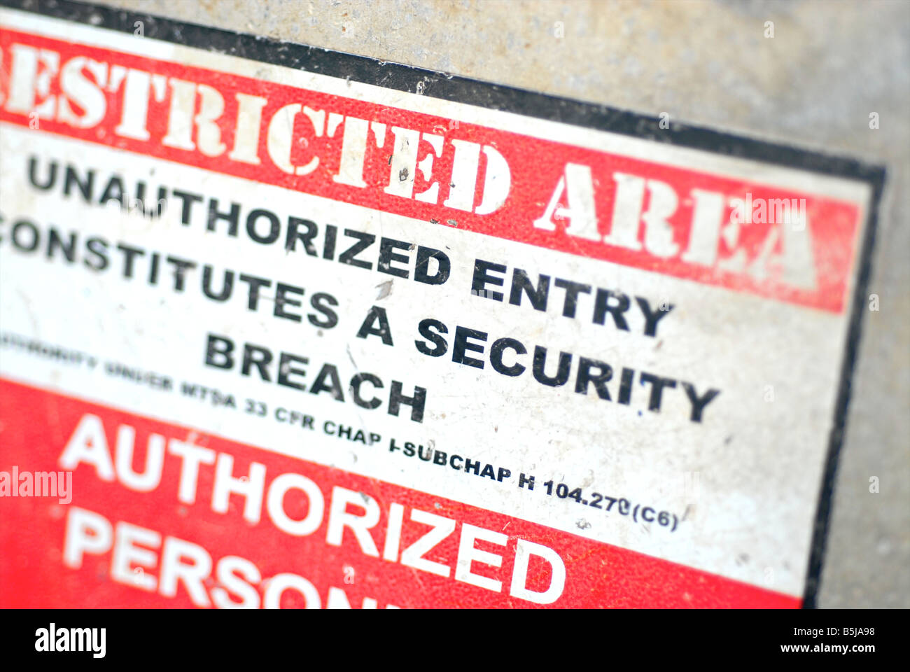 Restricted Area warning sign, white and black letters on red background ...