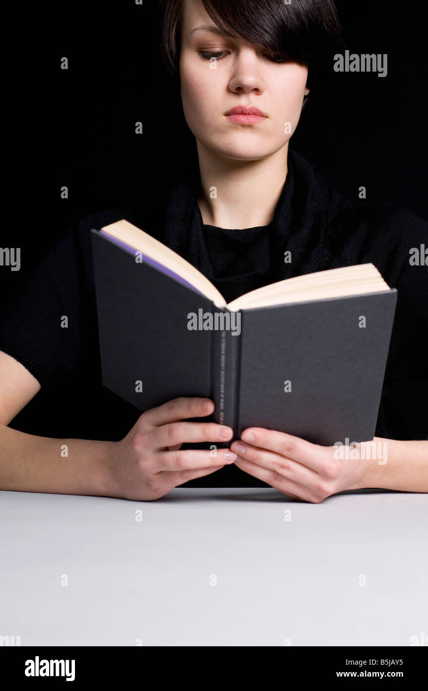portrait of young woman reading book Stock Photo - Alamy