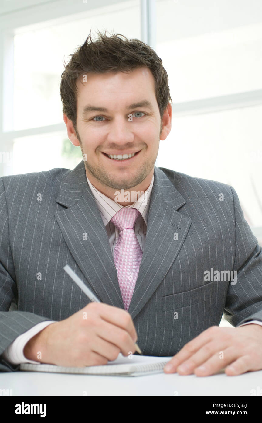portrait of businessman making notes Stock Photo - Alamy