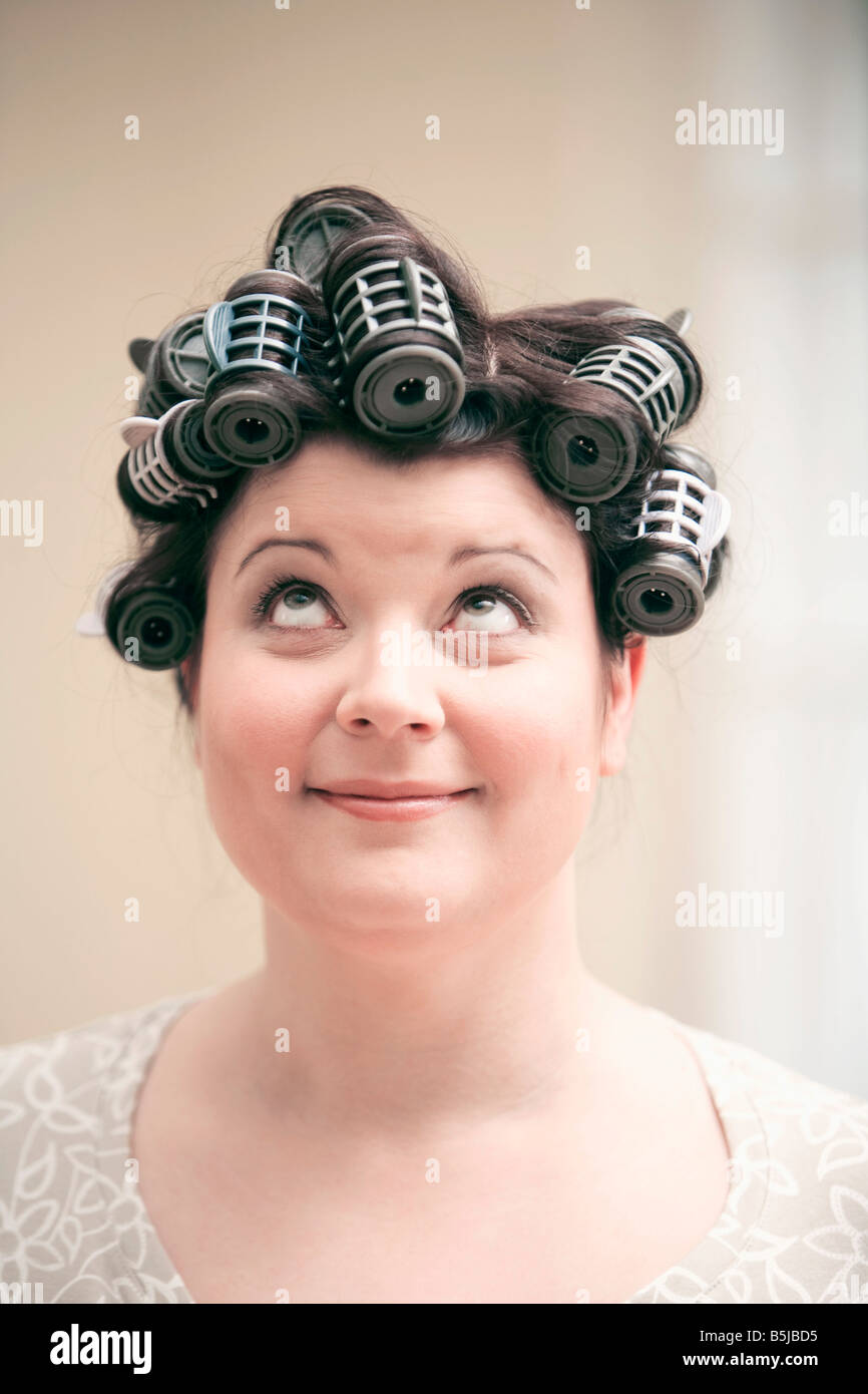 headshot of woman with curlers in her hair Stock Photo - Alamy