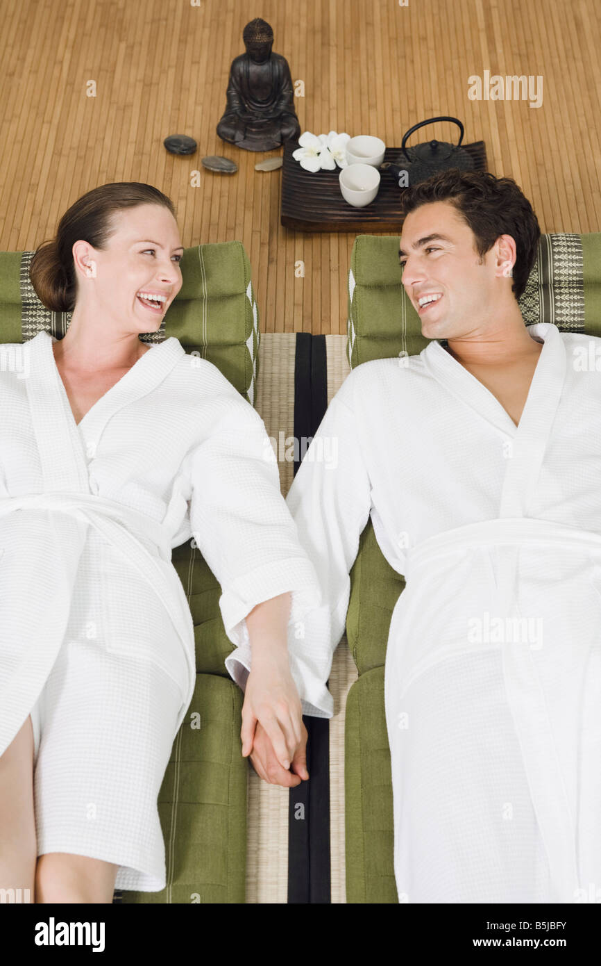 Couple in bathrobes holding hands hi-res stock photography and images ...